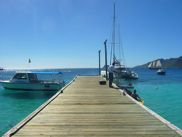 Marina with yachts and jetty as filming location on Caribbean islands